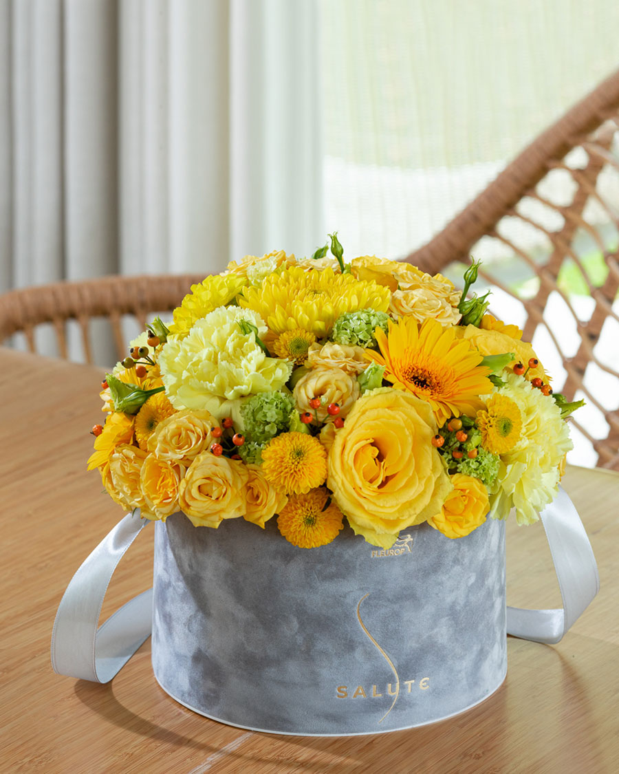 Sunny greetings in a light green velvet box | Birthday | Interflora ...